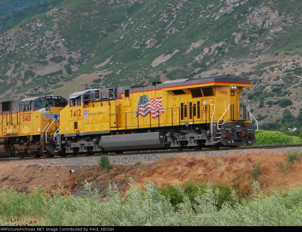 UP 7412 rolls past me with UP 8418 a SD-70ACe as rear DPU's on a eastbound Z.